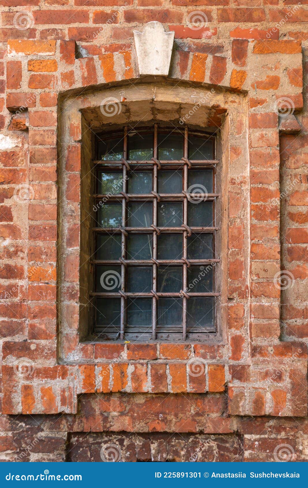 Medieval Window with Bars in a Brick Wall Stock Image - Image of glass ...