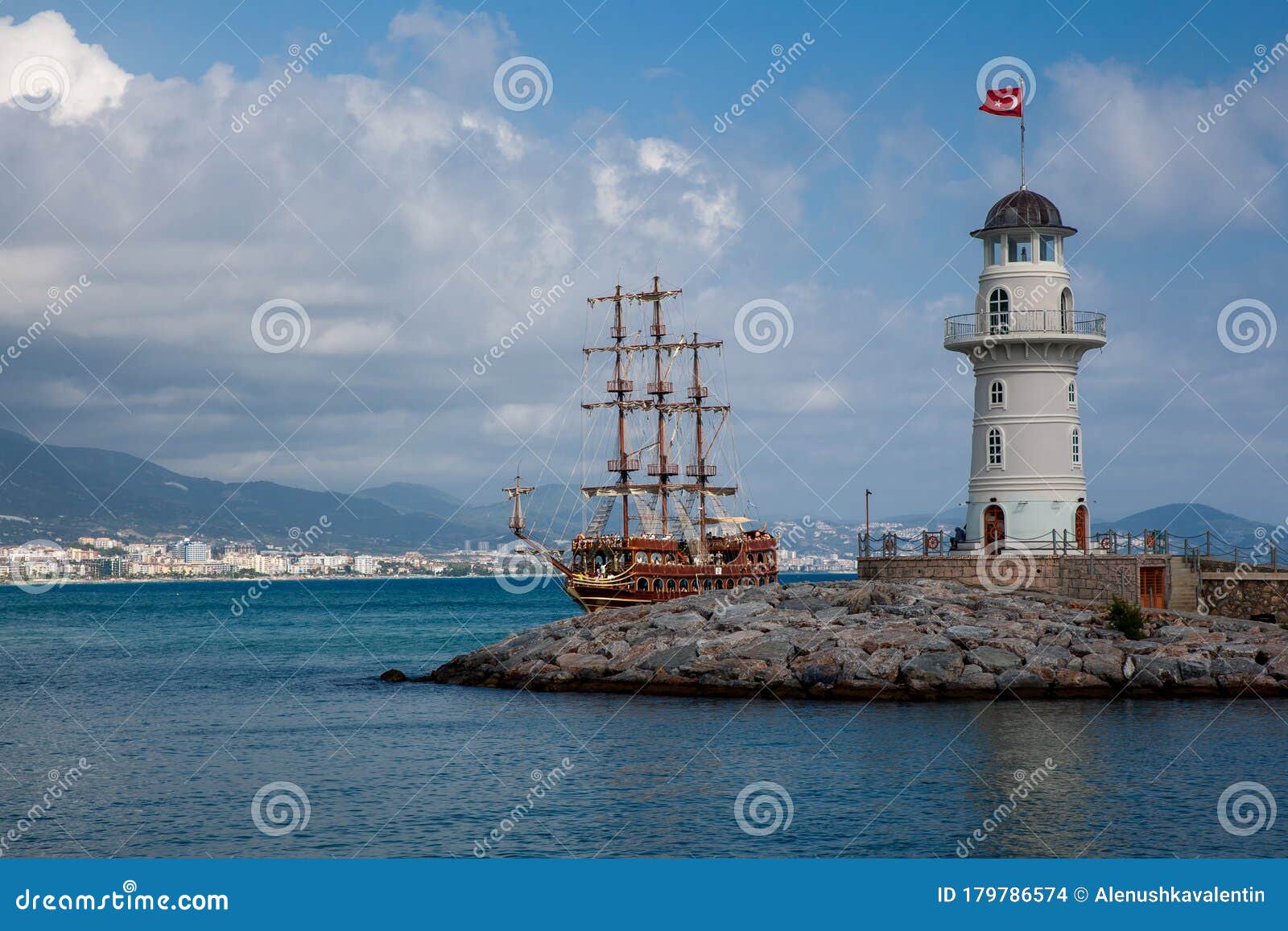 Medieval Wooden Ship and Lighthouse Stock Photo - Image of coast ...