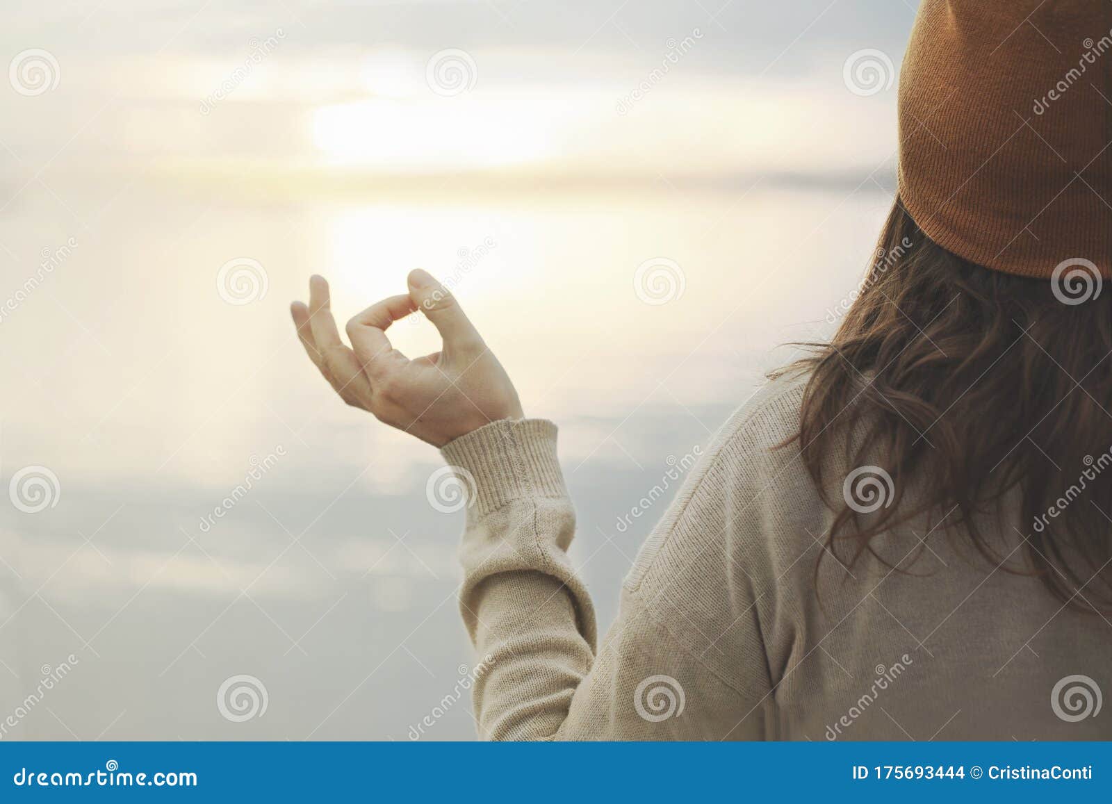 Meditative Woman Does Relaxation Exercises in Front of the Ocean Stock ...