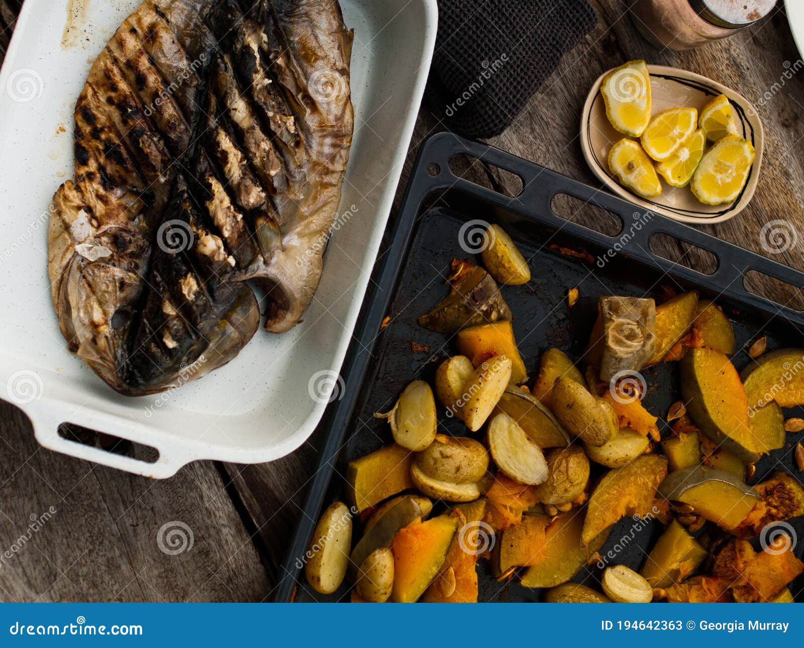 Mediterranean Fire Cooked Fish on Rustic Wooden Table Stock Image ...