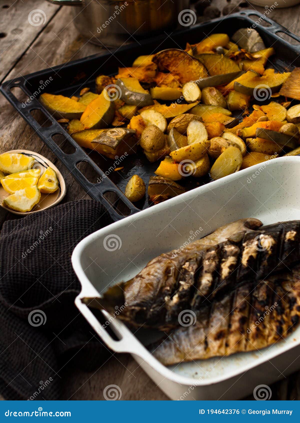 Mediterranean Fire Cooked Fish on Rustic Wooden Table Stock Photo ...