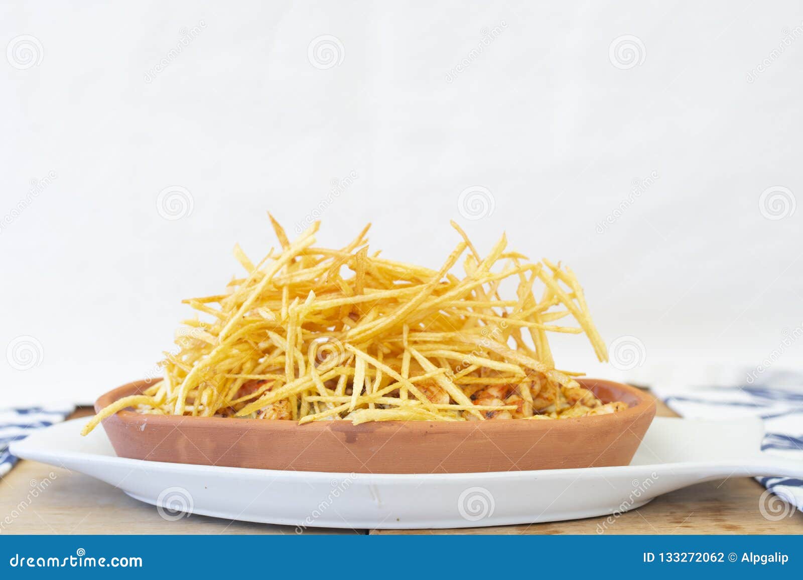 Mediterranean Style Prawn and Thin Strip Potatoes on Top Stock Photo ...