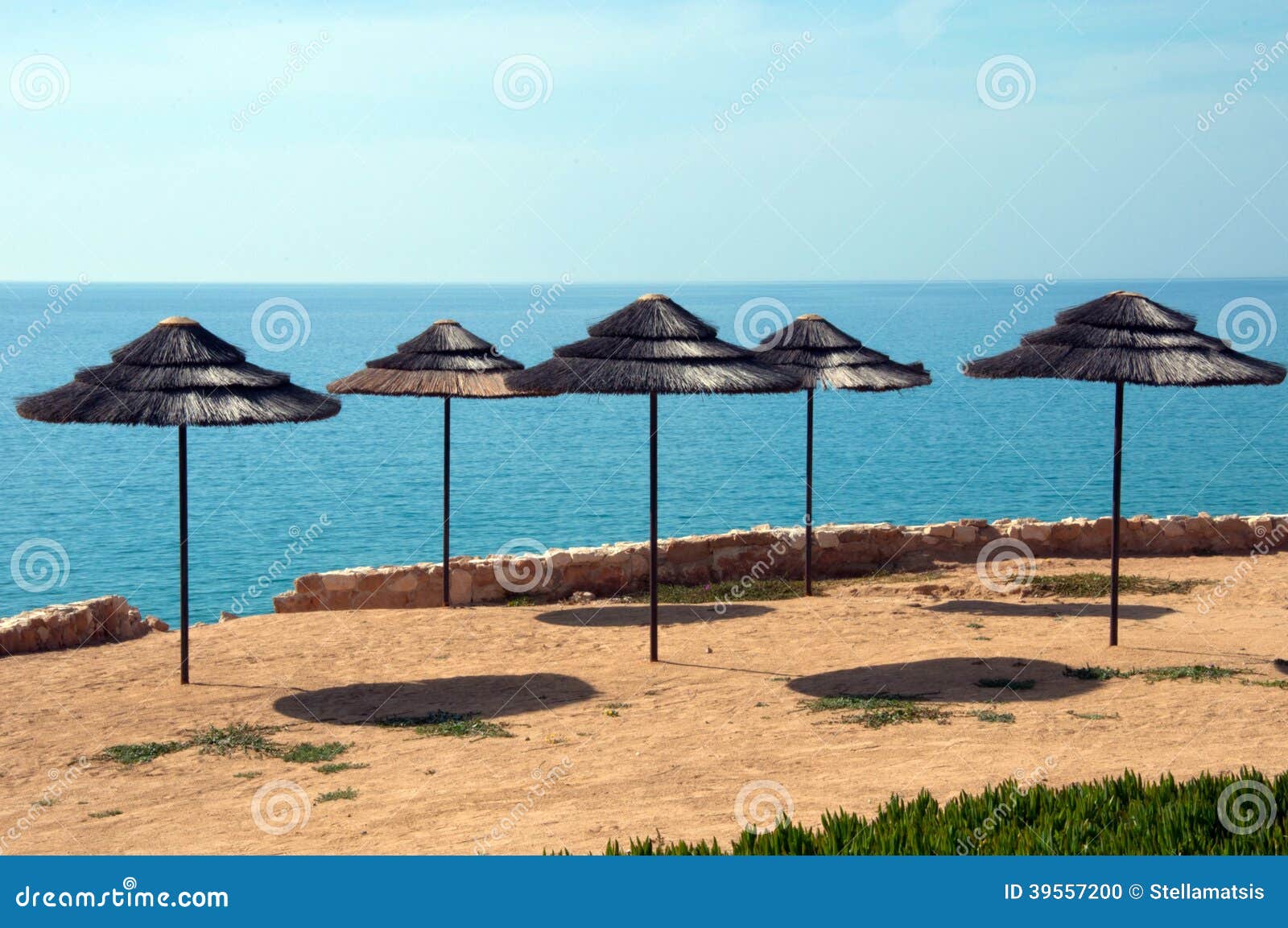 Mediterranean umbrellas stock photo. Image of beach, umbrella - 39557200