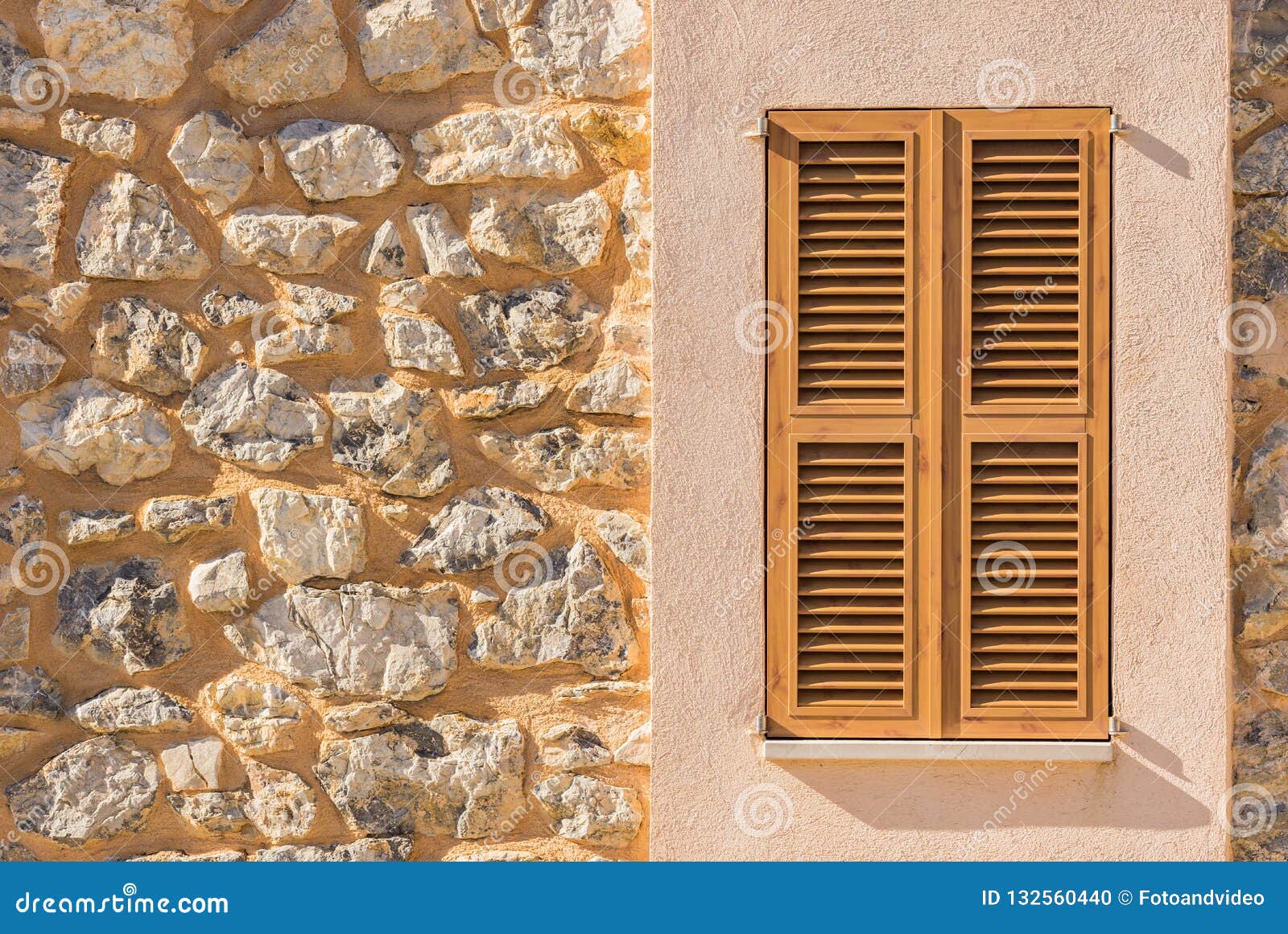 Light Brown Window Shutter with Rustic Stone Wall Stock Photo - Image ...