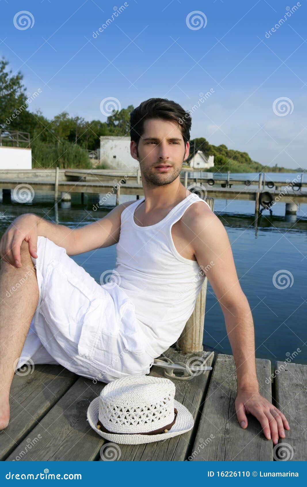 Mediterranean Young Man Relaxed on Wood Pier Stock Photo - Image of ...