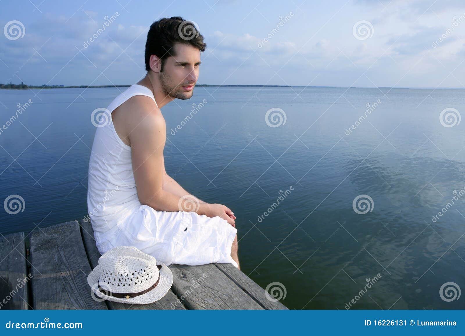 Mediterranean Young Man Relaxed on Wood Pier Stock Image - Image of ...