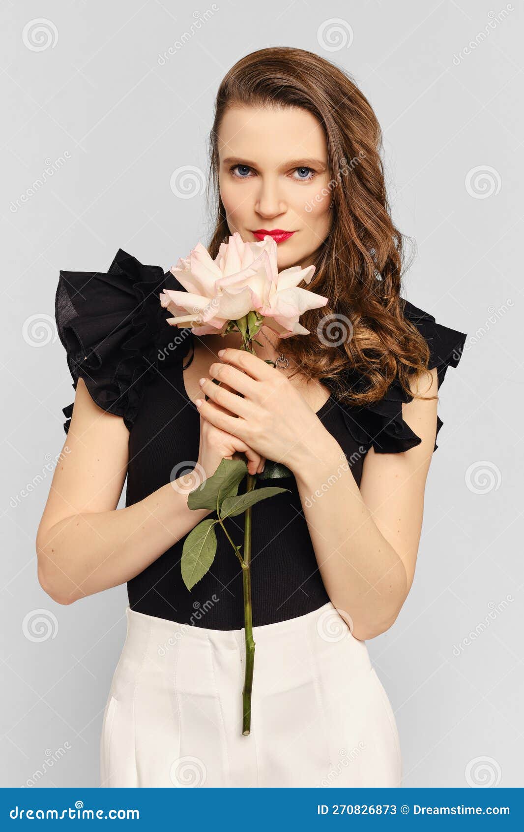Medium Closeup Portrait of Cute Woman Sniffs Beautiful Flower Stock ...