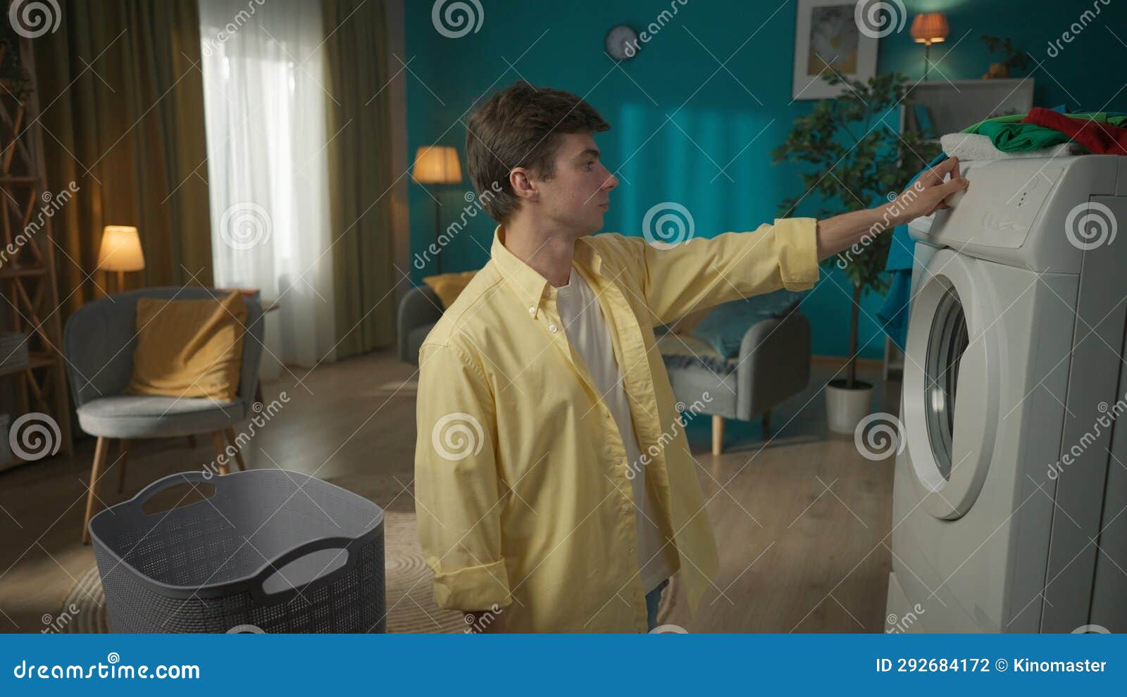 Medium-full Shot. Dark-haired Man Standing Next To a Washing Machine ...
