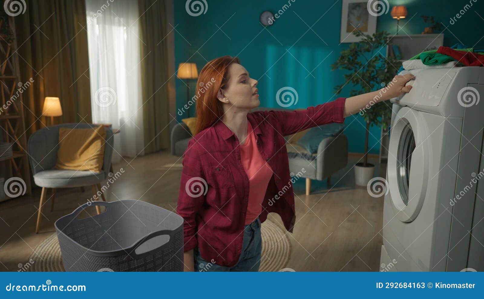 Medium-full Shot. Redhead Woman Standing Next To a Washing Machine ...