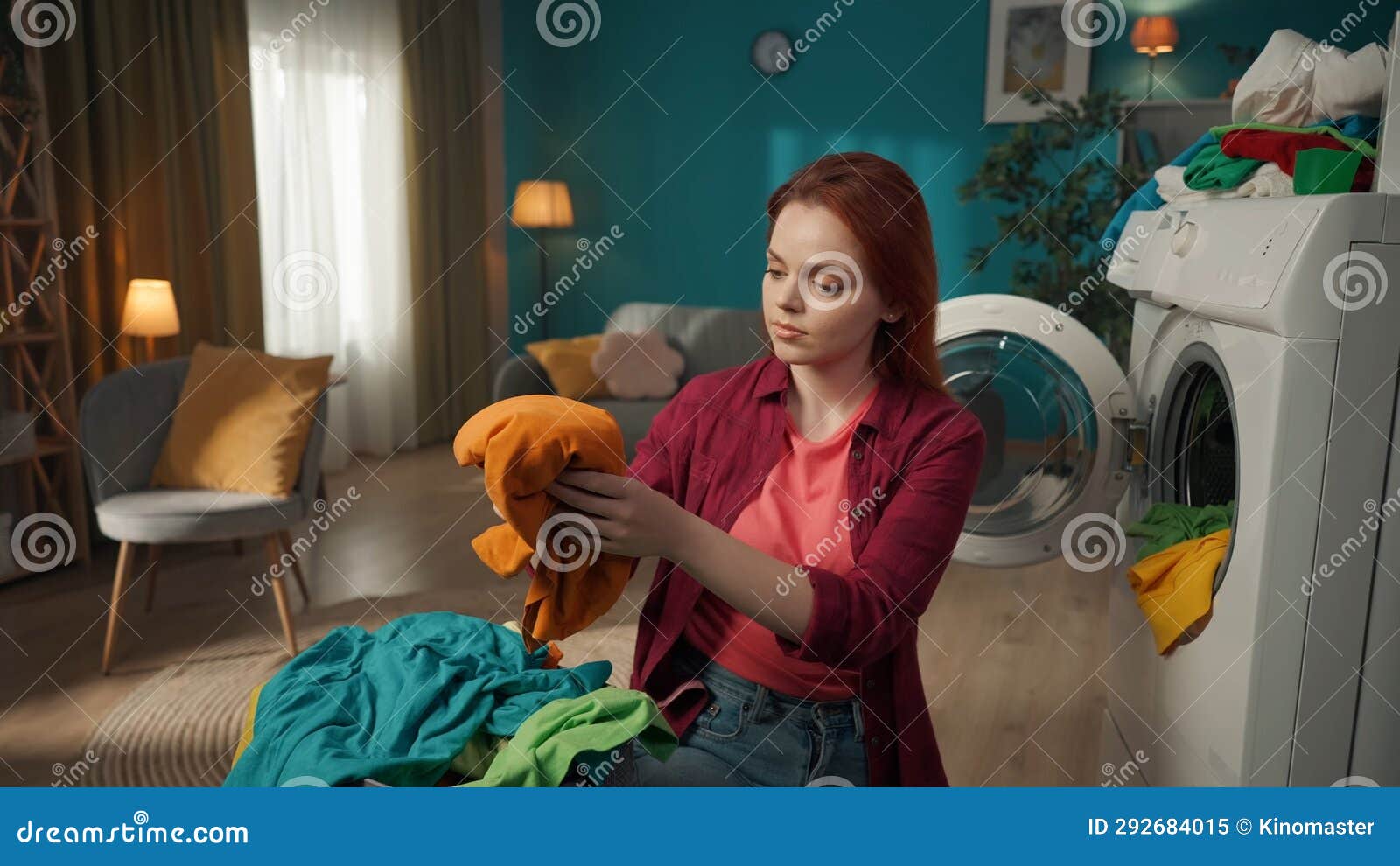 Medium-full Shot. Redhead Woman Unloading Washed Laundry from the ...