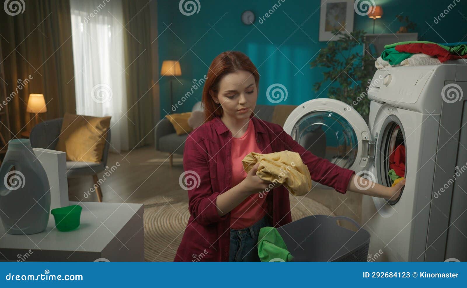 Medium-full Shot. Redhead Woman Unloading Washed Laundry from the ...