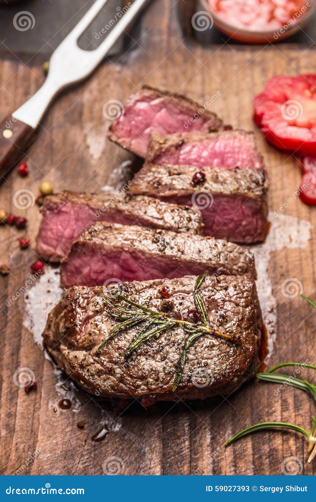 Medium Rare Roasted Beef Steak Slices on Rustic Wooden Background ...