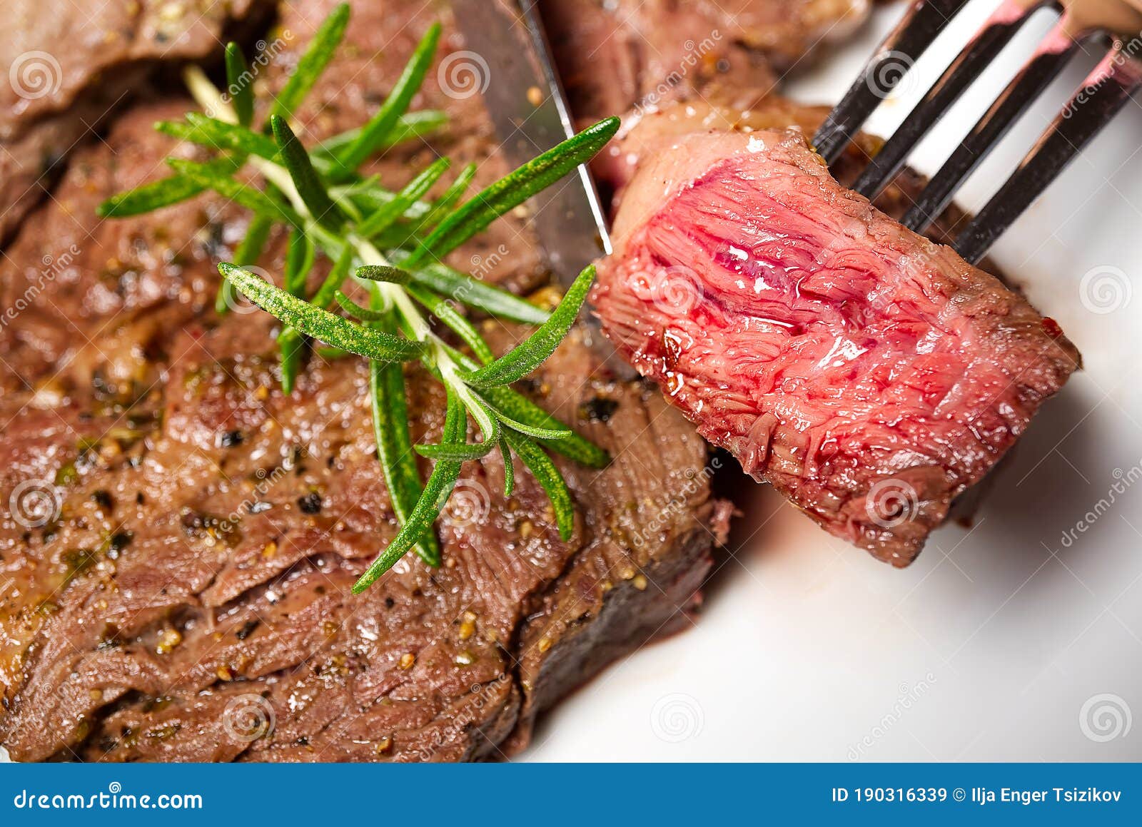 Medium Rear Beef Steak. White Plate with Piece of Beef Steak on Fork ...
