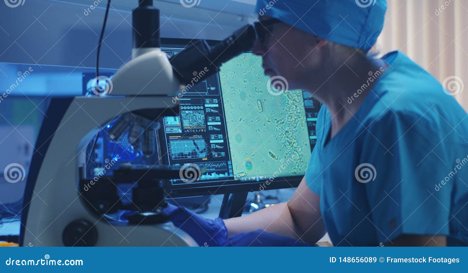 Biologist Analyzing Sample with Microscope Stock Image - Image of ...