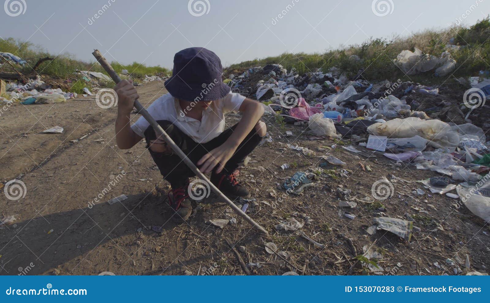 Boy Poking Ground with Stick Stock Video - Video of outdoors, cinematic ...