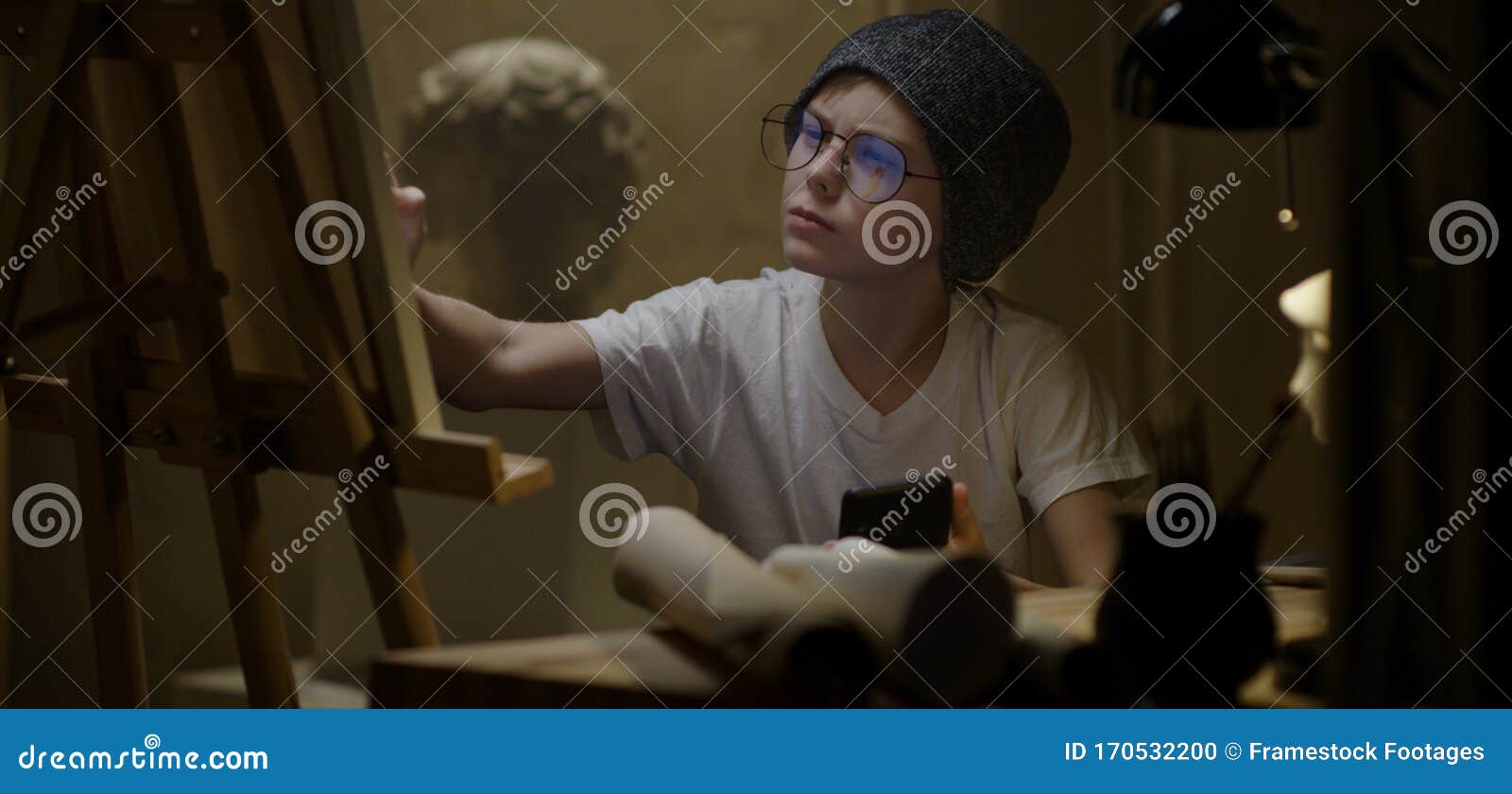 Boy Using Smartphone and Drawing Stock Photo - Image of artisan, canvas ...