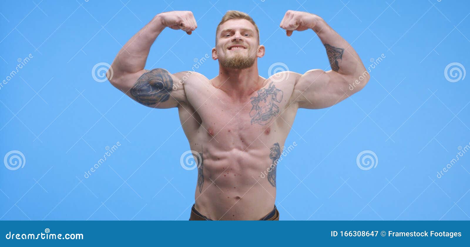 Buff man flexing his arms stock image. Image of flexing - 166308647