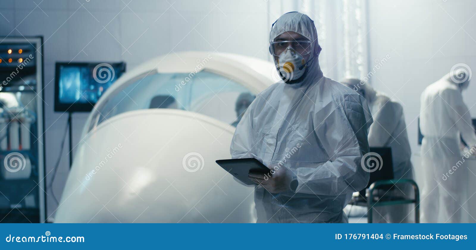 Engineer Turning To Camera in Clean Room Stock Photo - Image of ...