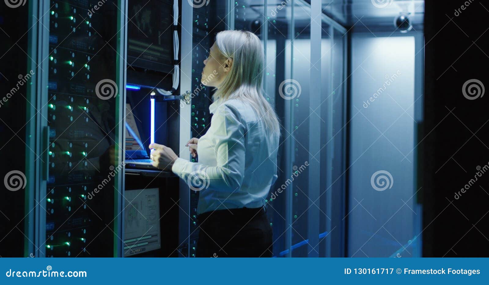 Female Technician Works on a Tablet in a Data Center Stock Image ...