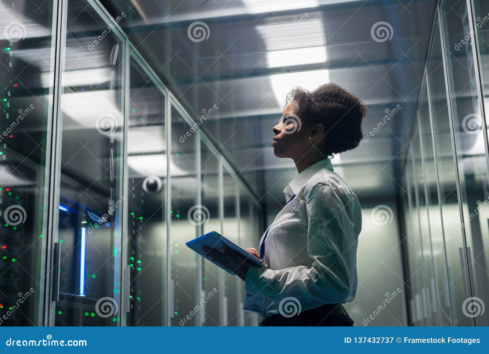 Female Technician Works on a Tablet in a Data Center Stock Image ...