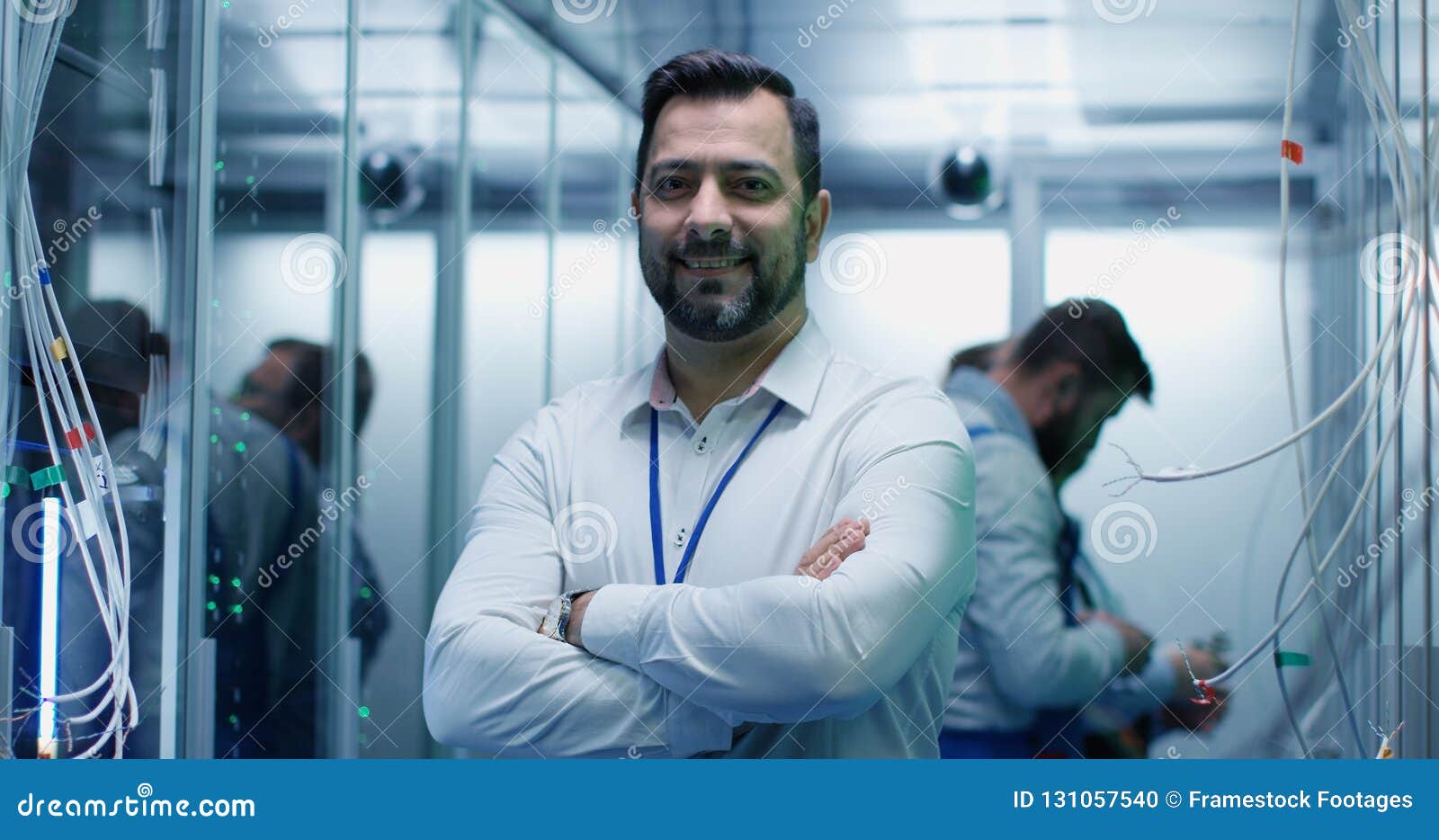 Male Manager Smiling in a Data Center Stock Photo - Image of ...