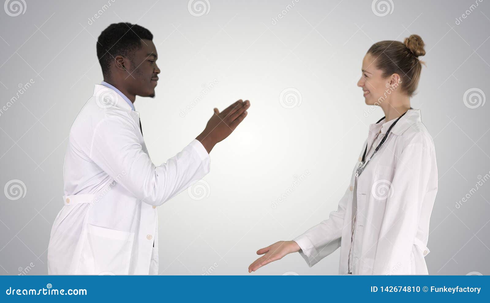 Successful Team of Surgeons Giving High Five and Laughing Wall on ...