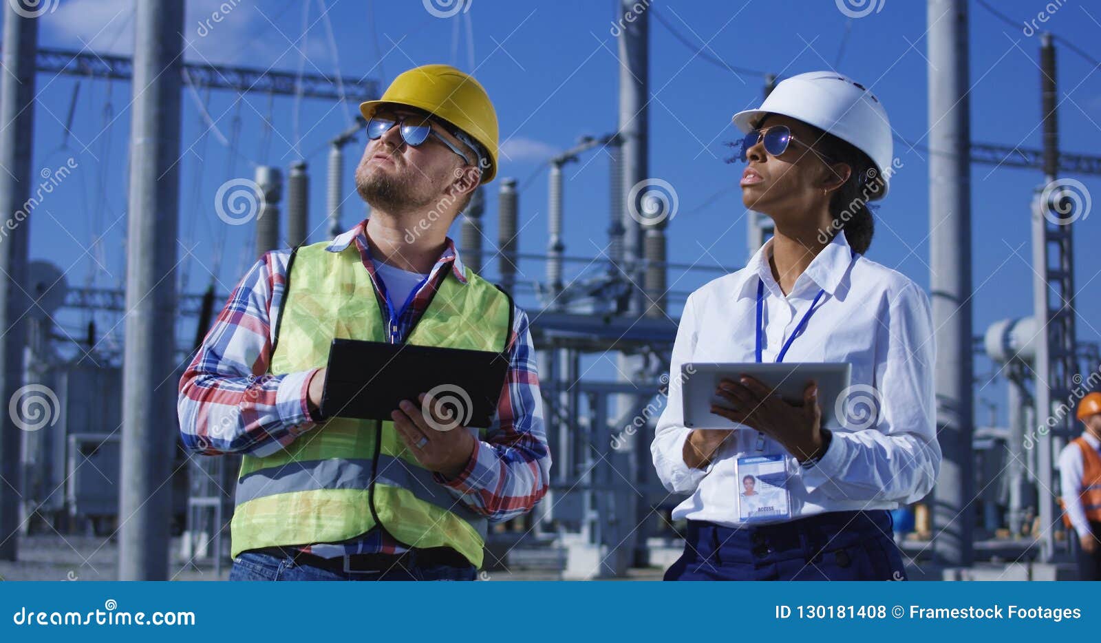 Two Electrical Workers on Tablets Outside Stock Photo - Image of ...