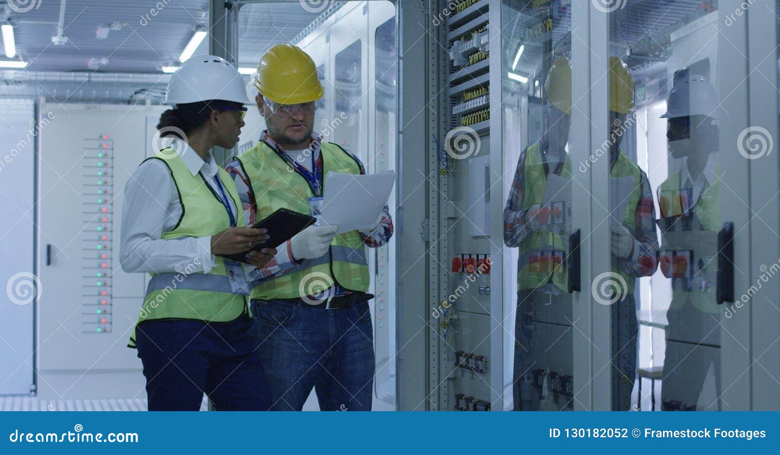 Two Electrical Workers Walking in the Control Room Stock Photo - Image ...