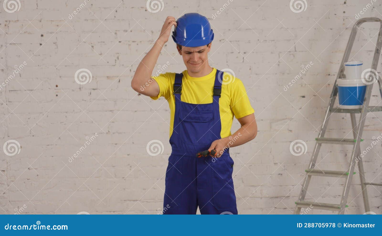 Medium Shot of a Young Construction Worker Standing in the Room Under ...