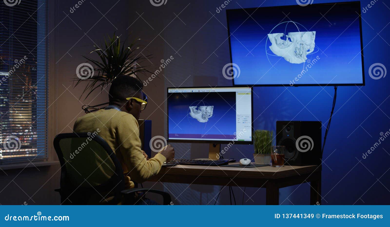 Young Man Sitting Back and Editing an Image on His Computer Stock Image ...