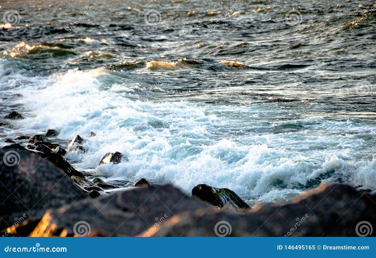 Medium Wave Rocking Against Rocks Stock Image - Image of rocks, wave ...