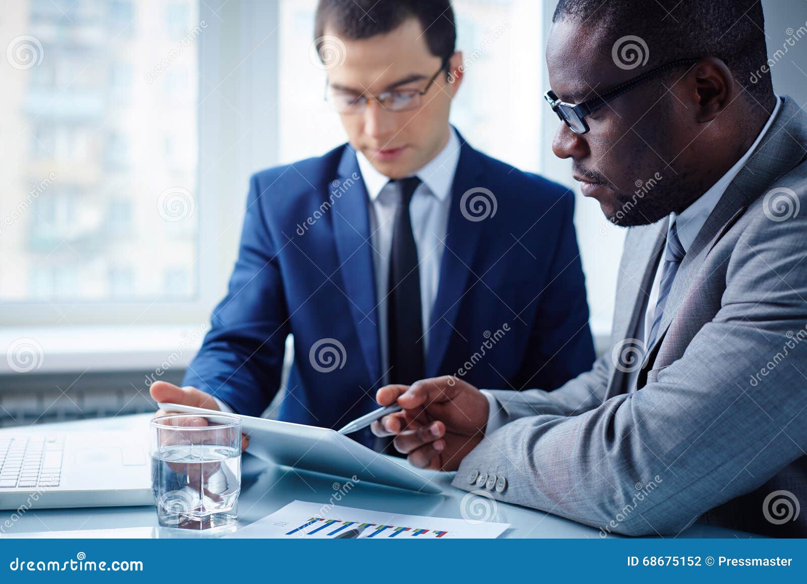 Meeting of businessmen stock photo. Image of gadget, person - 68675152