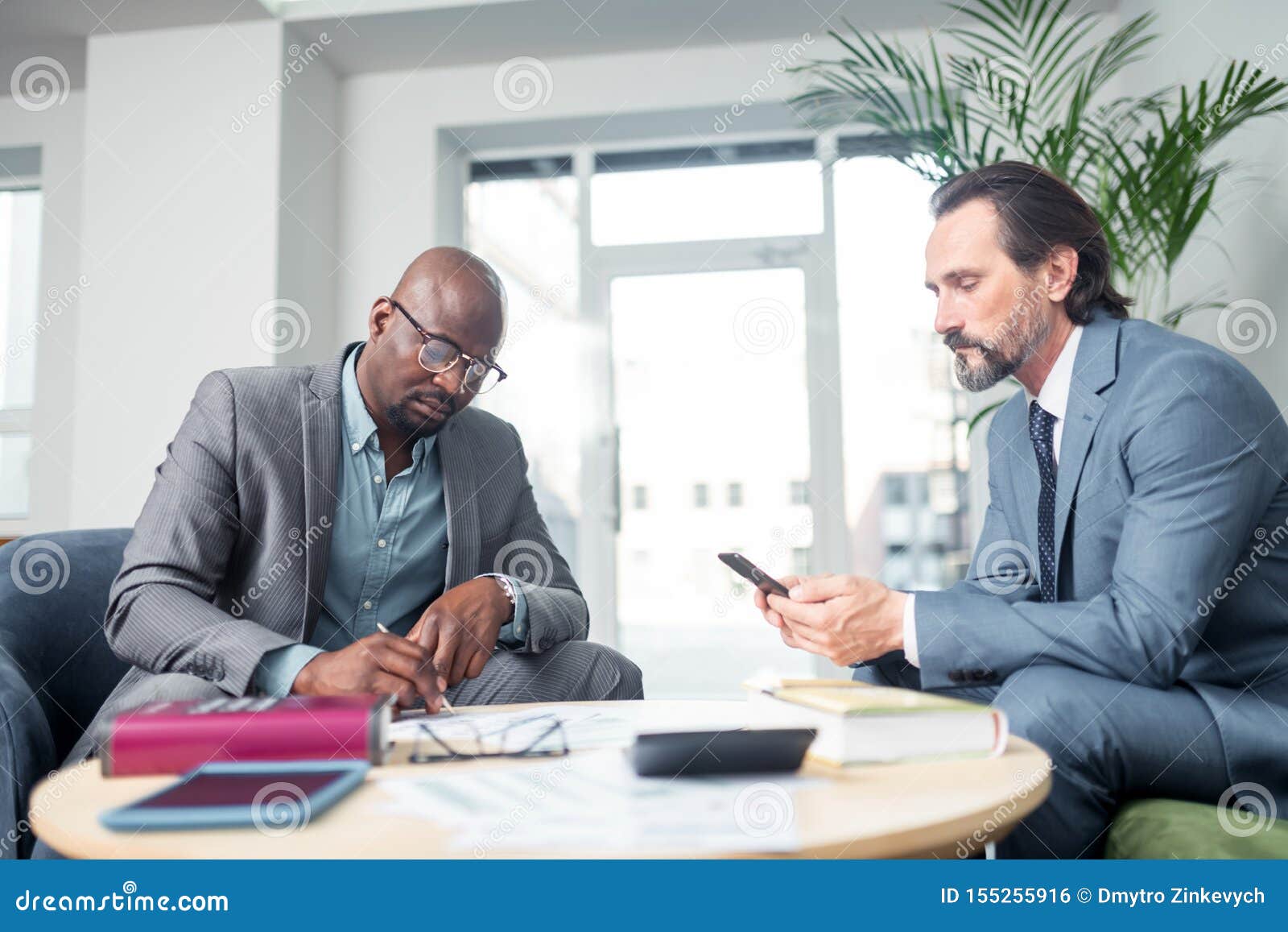 Business Partners Scheduling the Next Meeting and Negotiation Stock ...