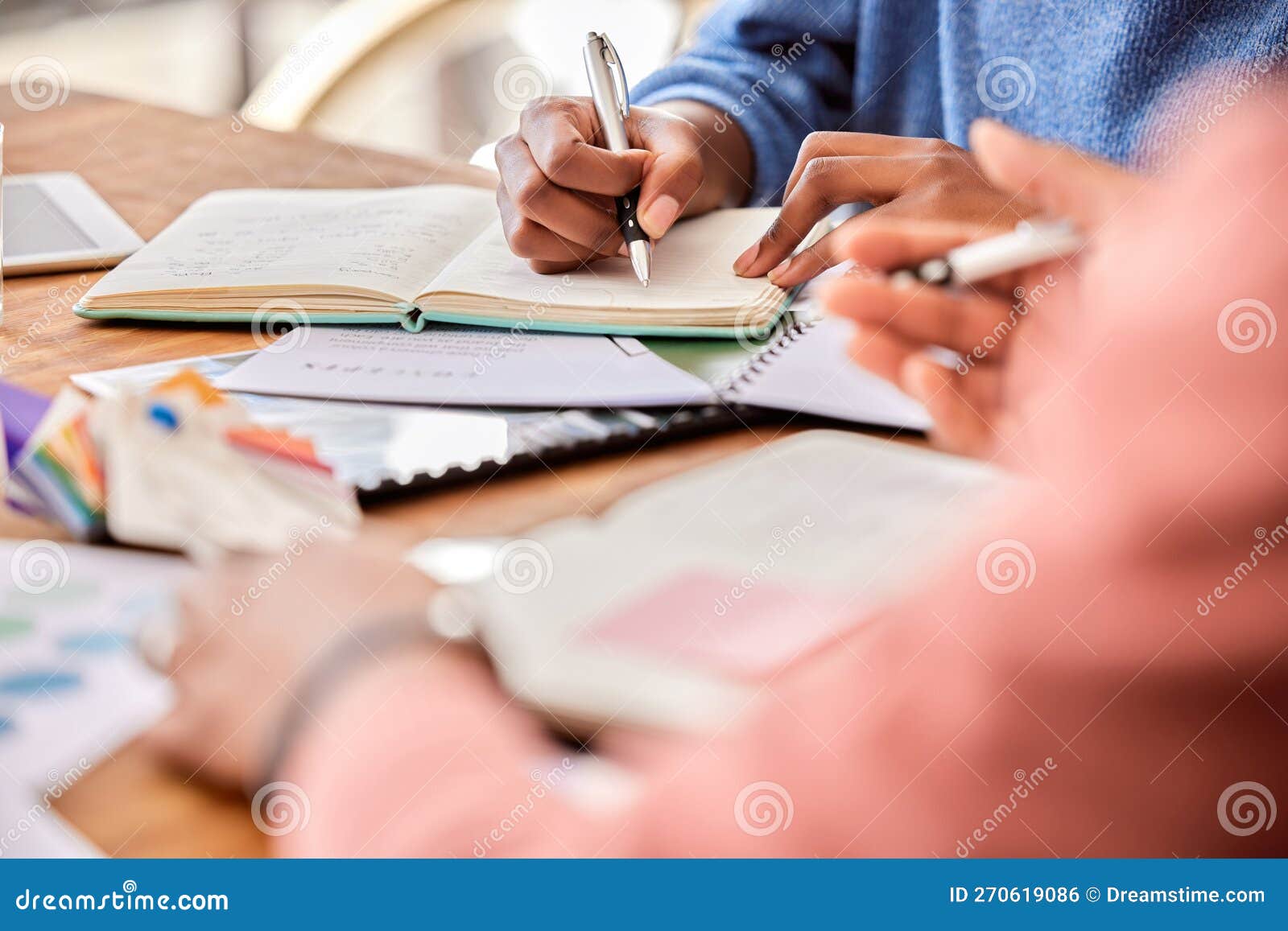 Meeting, Planning and Team Writing Notes while in Discussion on a ...