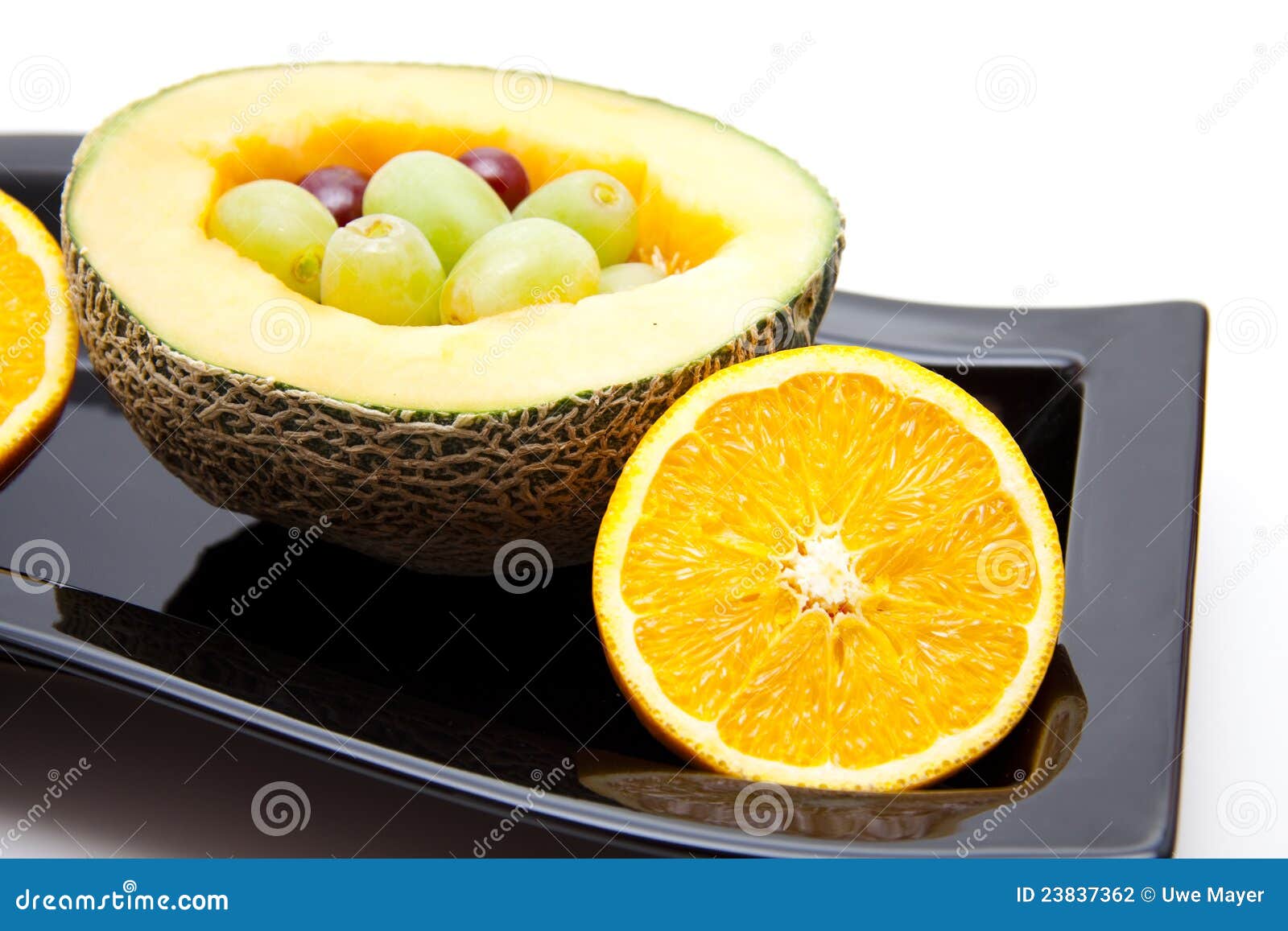 Melon with Grapes and Oranges Stock Photo - Image of stuffed, grapes ...