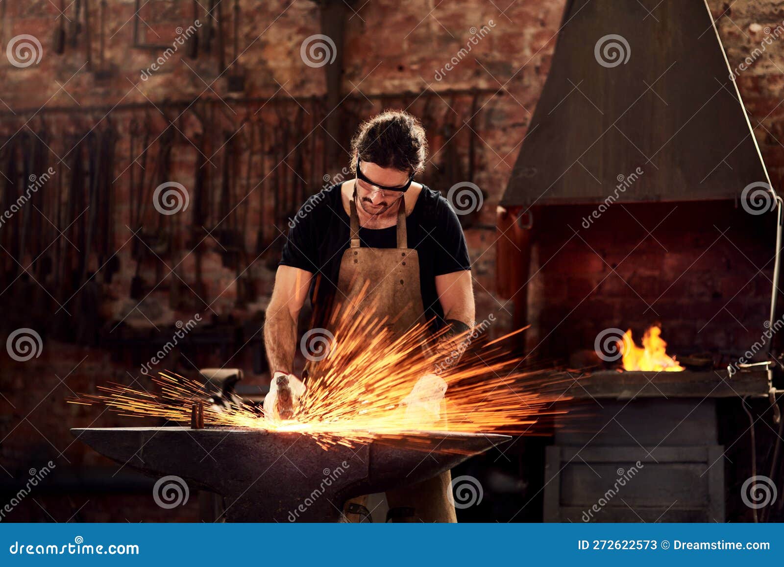 Melt it All Away. a Handsome Young Metal Worker Using a Blowtorch while ...