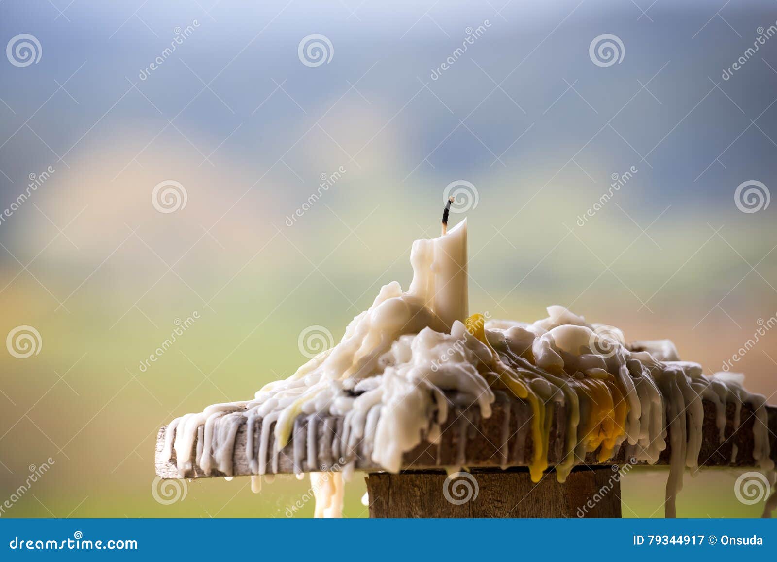 Melted candle on wood pole stock image. Image of burn - 79344917