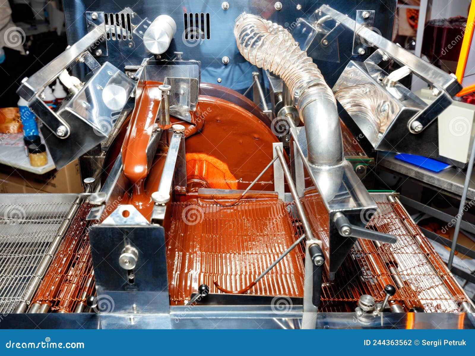 Chocolate Icing is Poured in an Industrial Candy Production Process ...