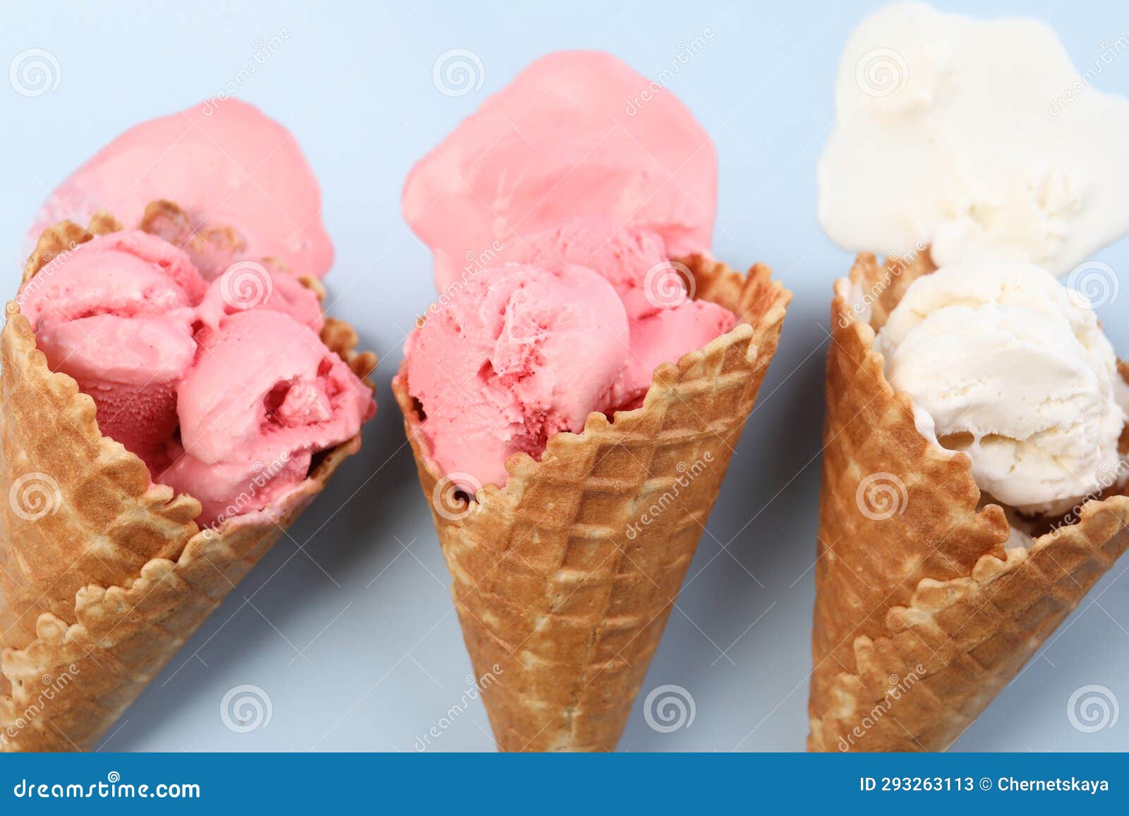 Melted Ice Cream in Wafer Cones on Light Blue Background, Flat Lay ...