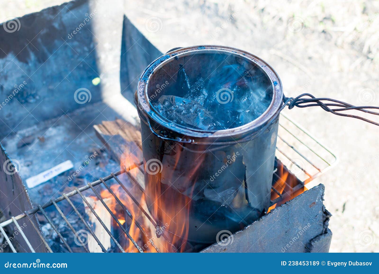 Melting Black Tar Over a Fire in a Can of Smoke Stock Image - Image of ...