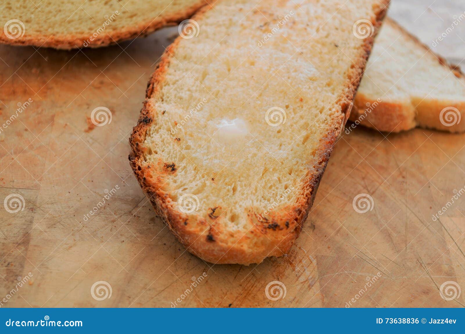 Melting Butter on a Slice of Rustic Toasted Bread Stock Photo - Image ...