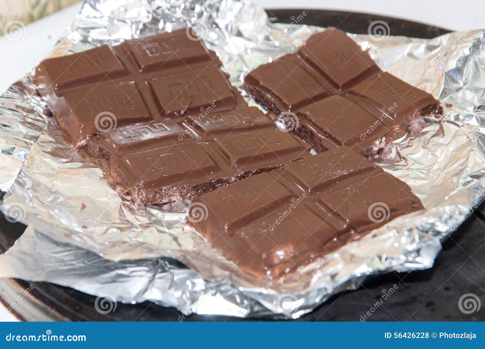 Melting Cooking Chocolate on the Paper Stock Photo - Image of cream ...