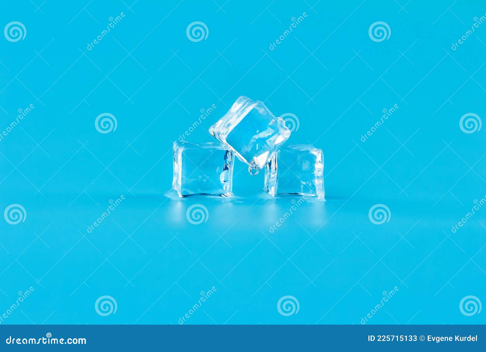 Melting Ice On A Blue Background. A Dripping Drop From The Central Ice ...