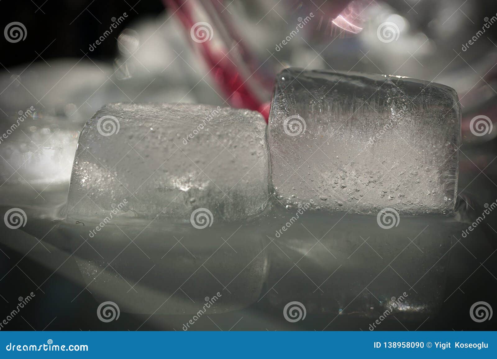 Melting Ice Cubes Close Up stock photo. Image of goldenhour - 138958090