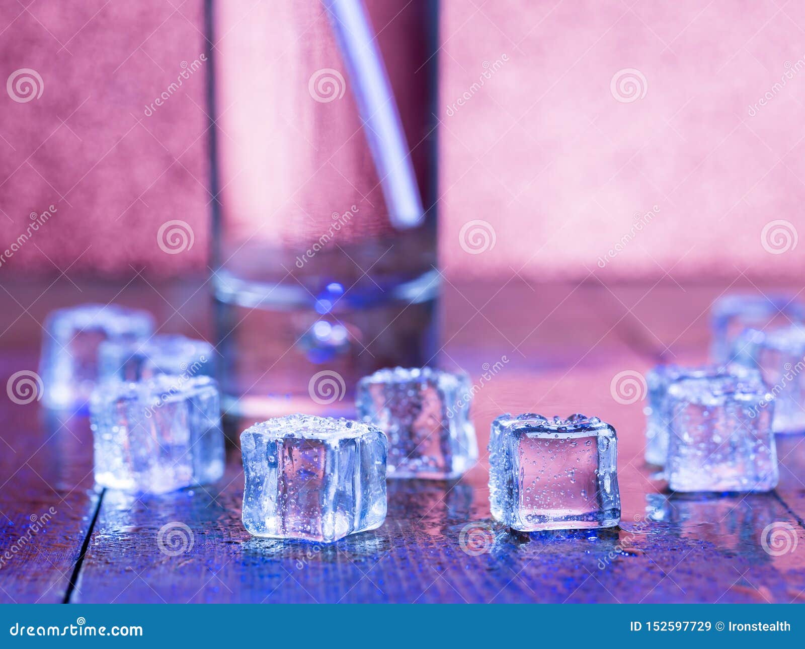Melting Ice Cubes on a Wooden Table. Close-up Stock Image - Image of ...