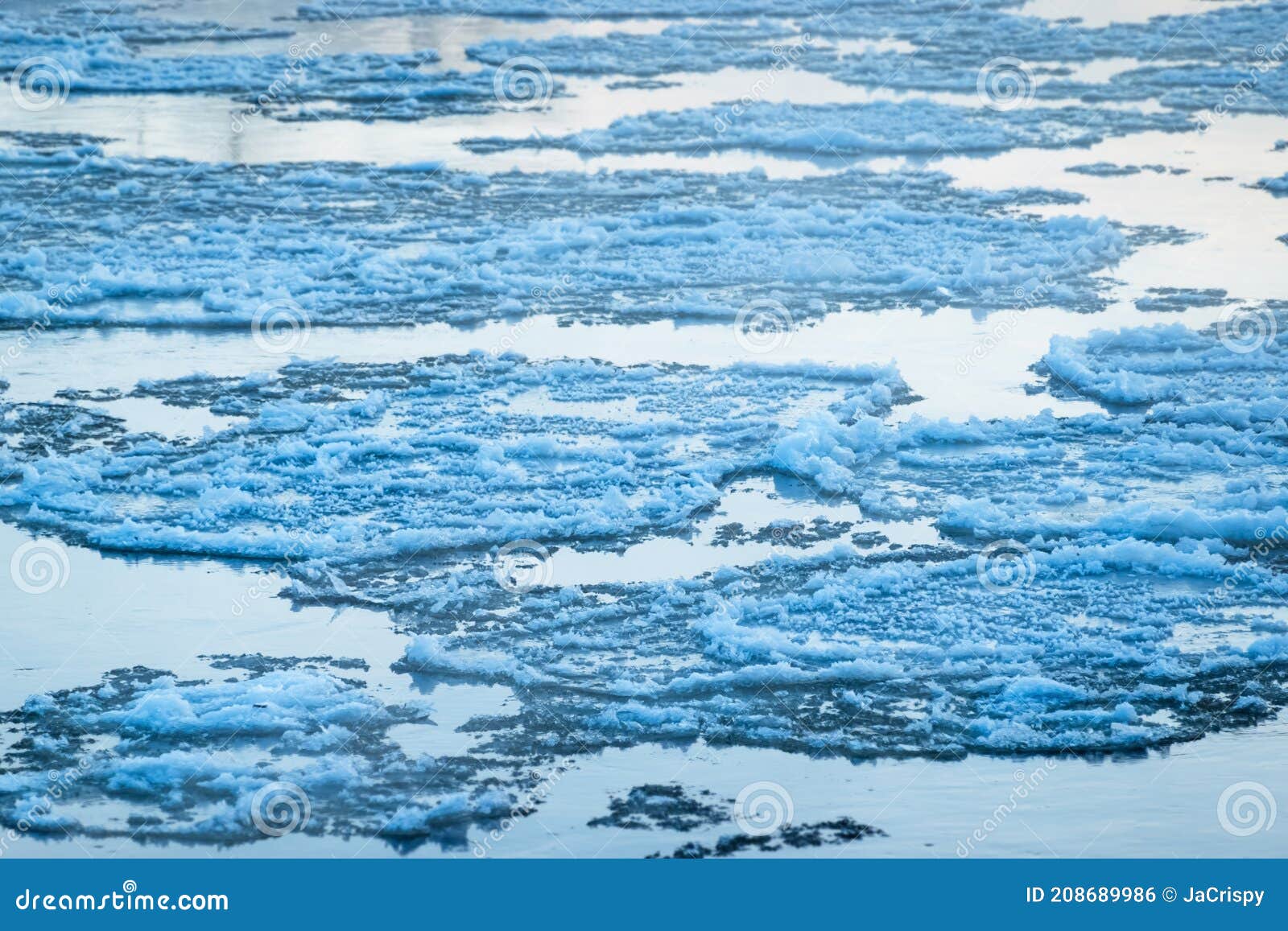 Melting Ice Flowing on Water Surface. Ice Drift on the River Stock ...