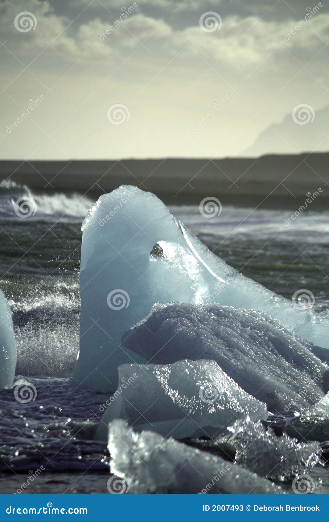 The Melting Iceberg On Spring Mountain Lake In The Setting Sun. Royalty ...