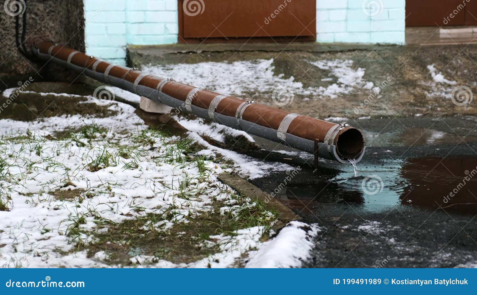 Meltwater Flows through a Storm Drain Pipe . Concept of the Onset of ...