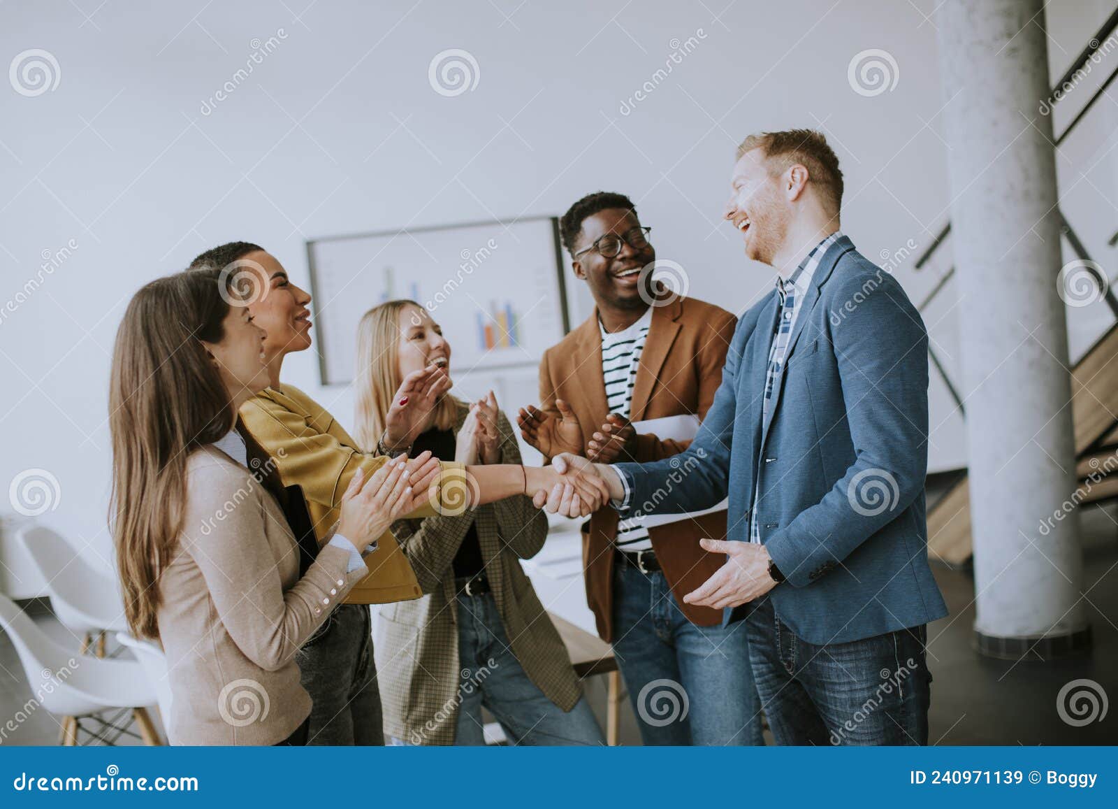 Memembers of Creative Team Shaking Hands while Working in the Modern ...