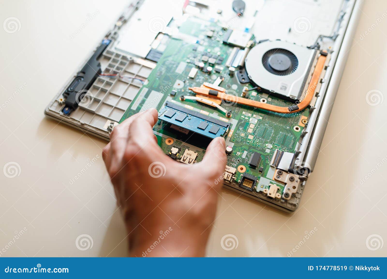 RAM Memory Module In Hand. Motherboard And Hard Disk In Background ...